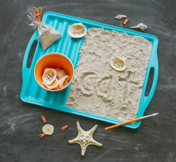 Kids Writing Game with Sand and Seashells